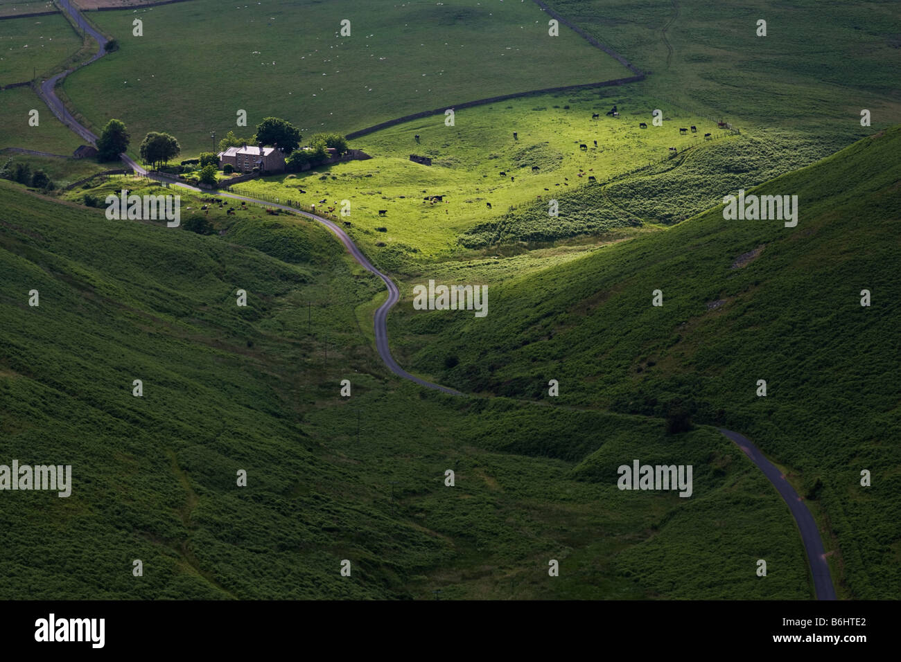 Farm in the Ingram Valley spotlit by a shaft of sunlight in the ...