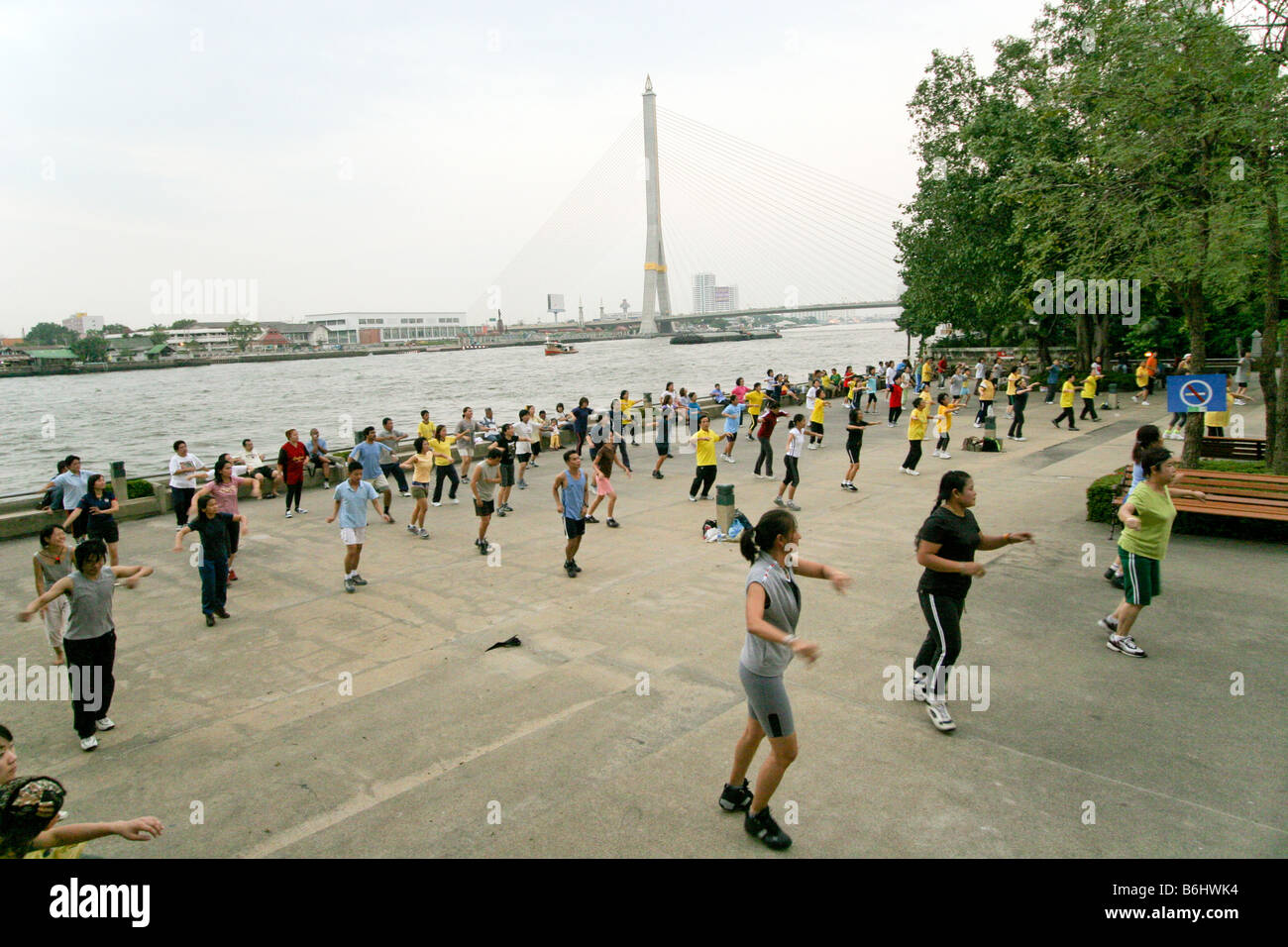 people at stretching in a square near Chao Phraya river, bangkok ...