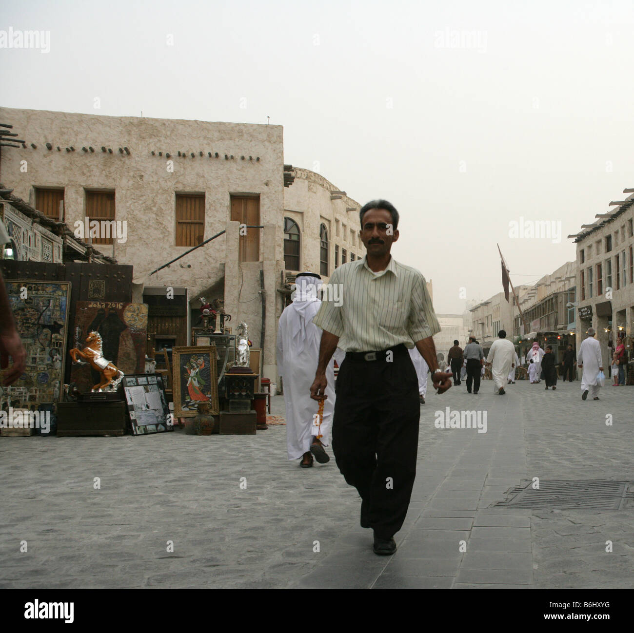 Locals strolling through the Souq Waqif market in Doha, Qatar Stock ...