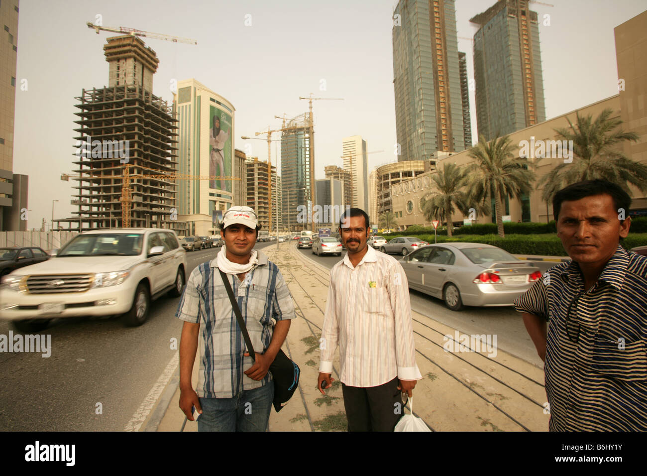 Migrant construction workers in downtown Doha, Qatar Stock Photo - Alamy