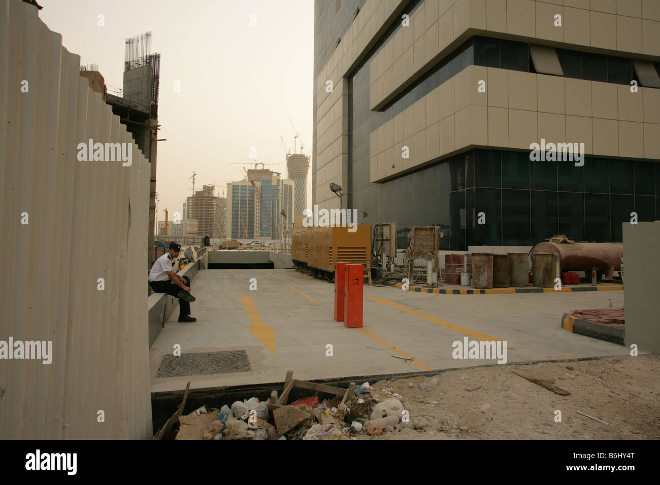 An immigrant working as security guard in downtown Doha, Qatar Stock ...