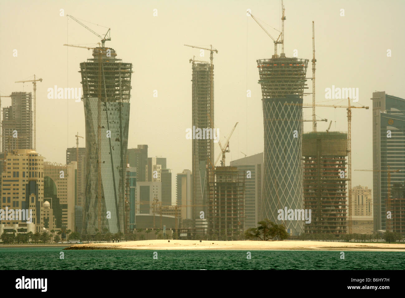 Skyline formed of city's skyscrapers under construction, Doha, Qatar ...