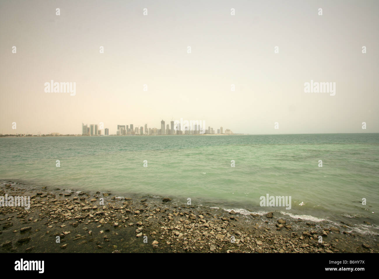 Scenic view of Doha's distant waterfront skyline from Doha bay, Qatar ...