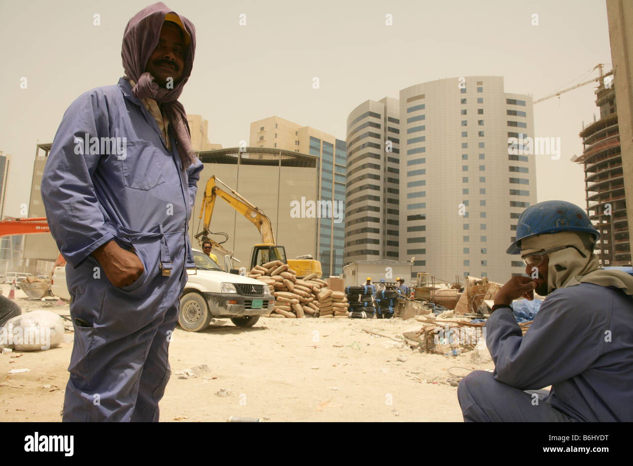 Migrant workers at a construction site in Doha, Qatar Stock Photo - Alamy