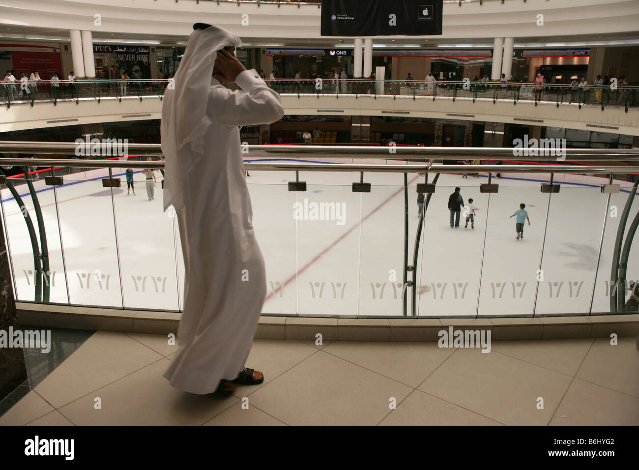 Man in traditional attire at the City Center Mall ice rink in Doha ...