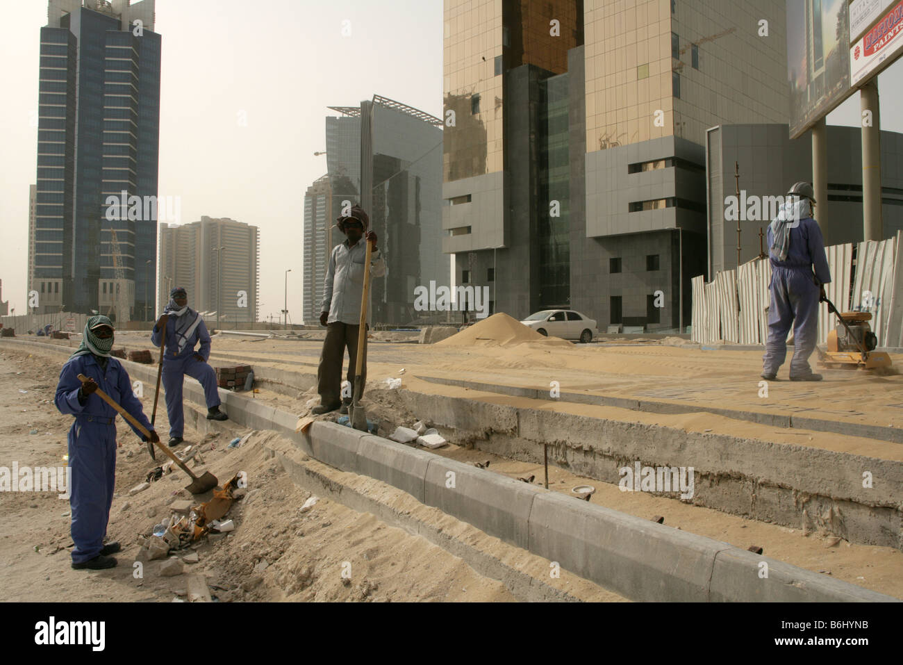 Construction workers in downtown Doha, Qatar Stock Photo - Alamy