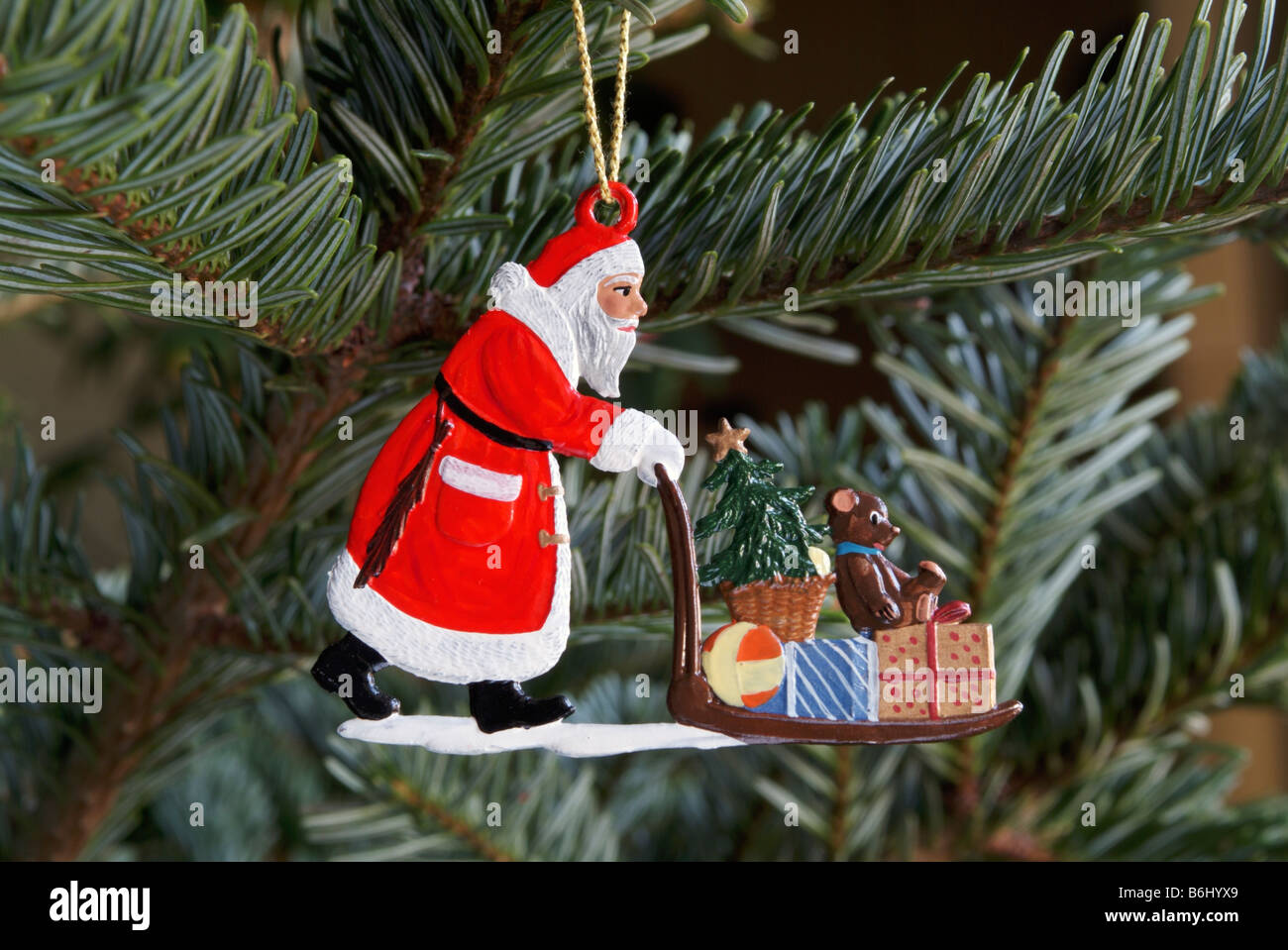 A hand painted tin Father Christmas tree decoration from Germany Stock ...