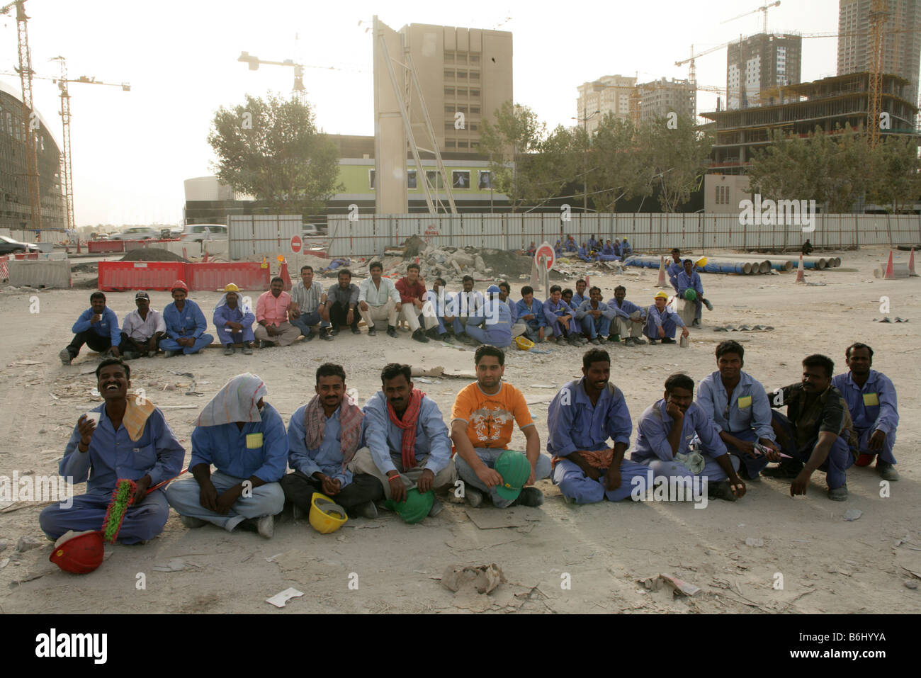 Migrant construction workers in downtown Doha, Qatar Stock Photo - Alamy