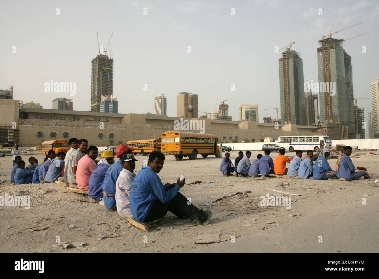 Migrant construction workers in downtown Doha, Qatar Stock Photo - Alamy