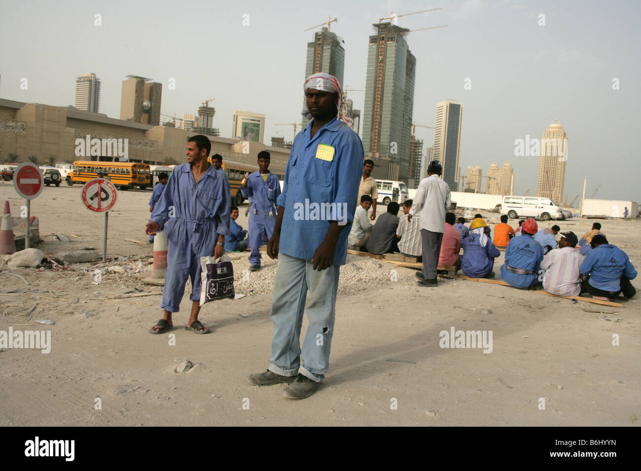 Migrant construction workers in downtown Doha, Qatar Stock Photo - Alamy