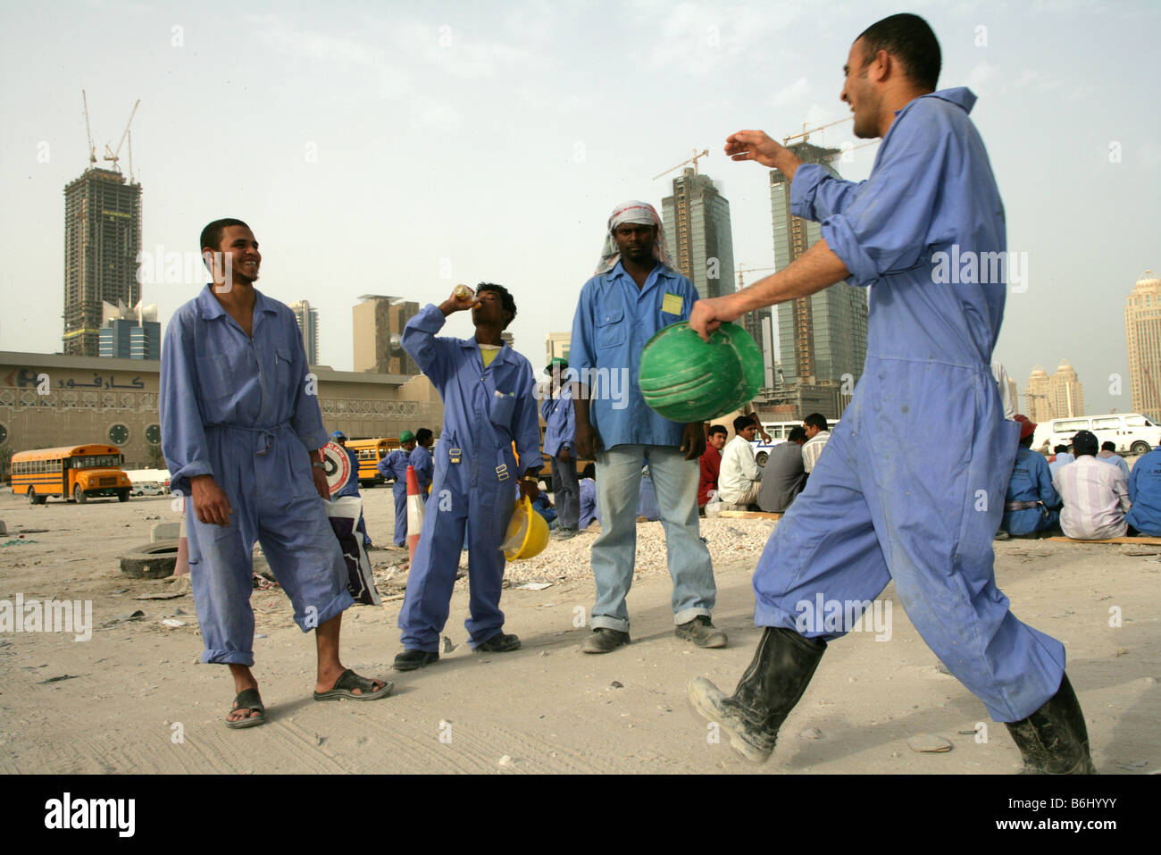 Migrant construction workers in downtown Doha, Qatar Stock Photo - Alamy