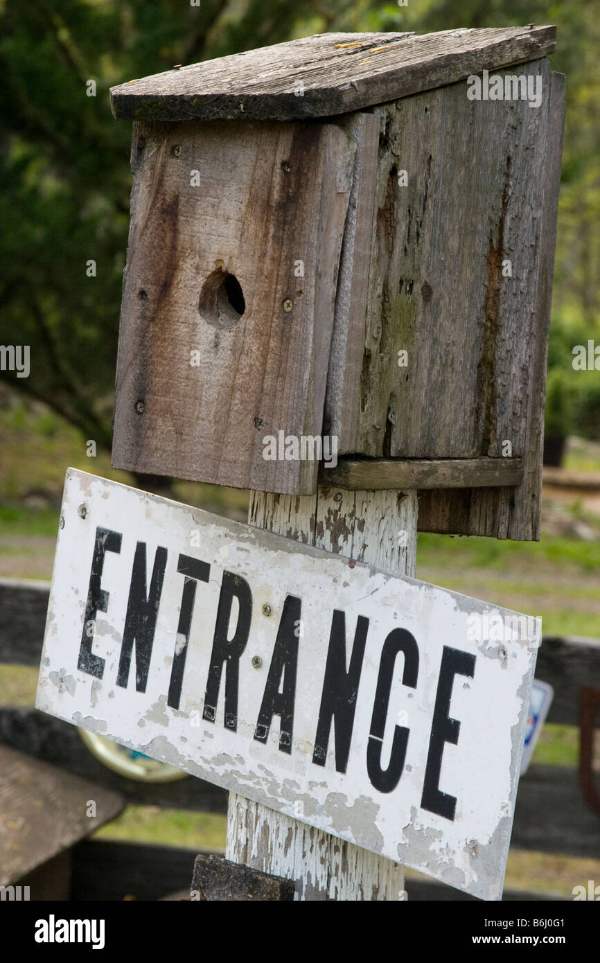Birdhouse and entrance sign Stock Photo - Alamy