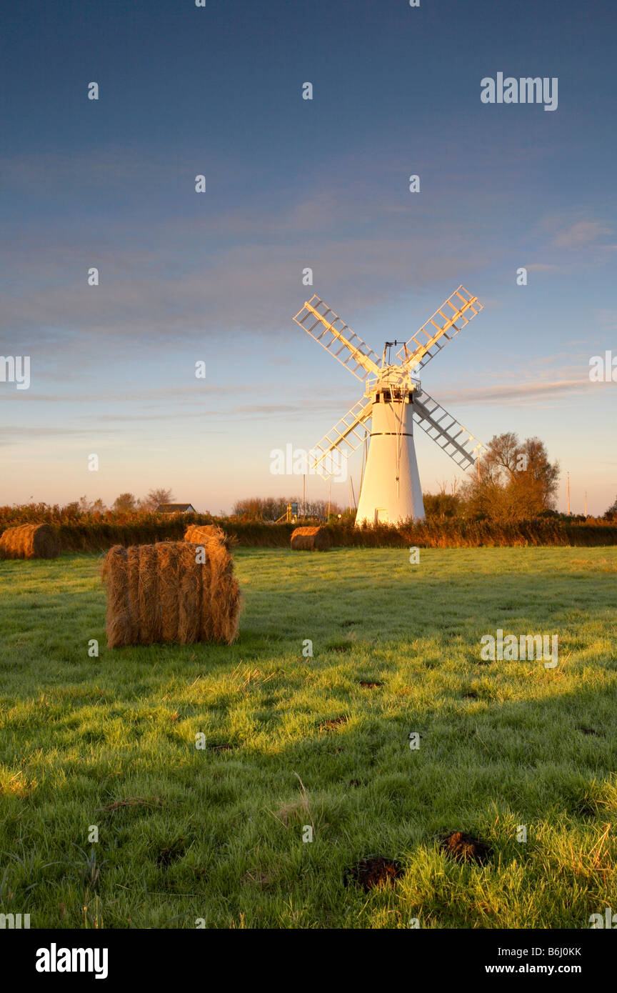 Thurne windmill and hay bales on marshland on the Norfolk Broads Stock ...