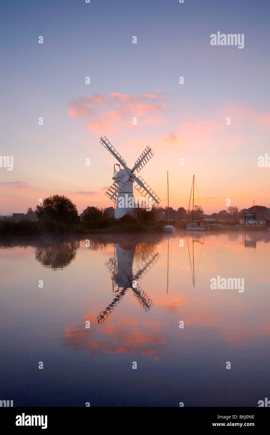 Thurne Windmill photographed on a clam misty morning at sunrise on the ...