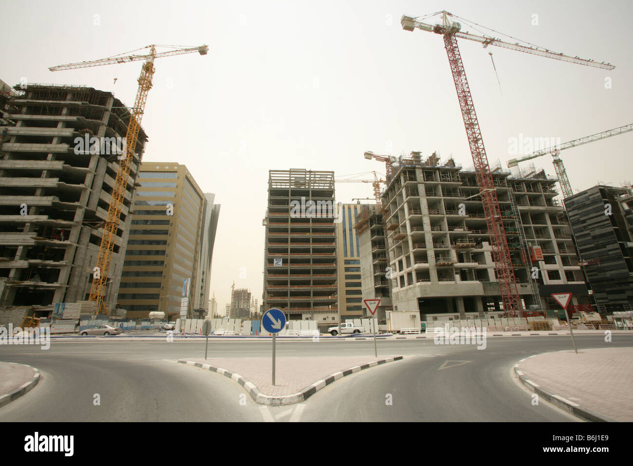 Construction site with construction cranes above tower blocks in ...