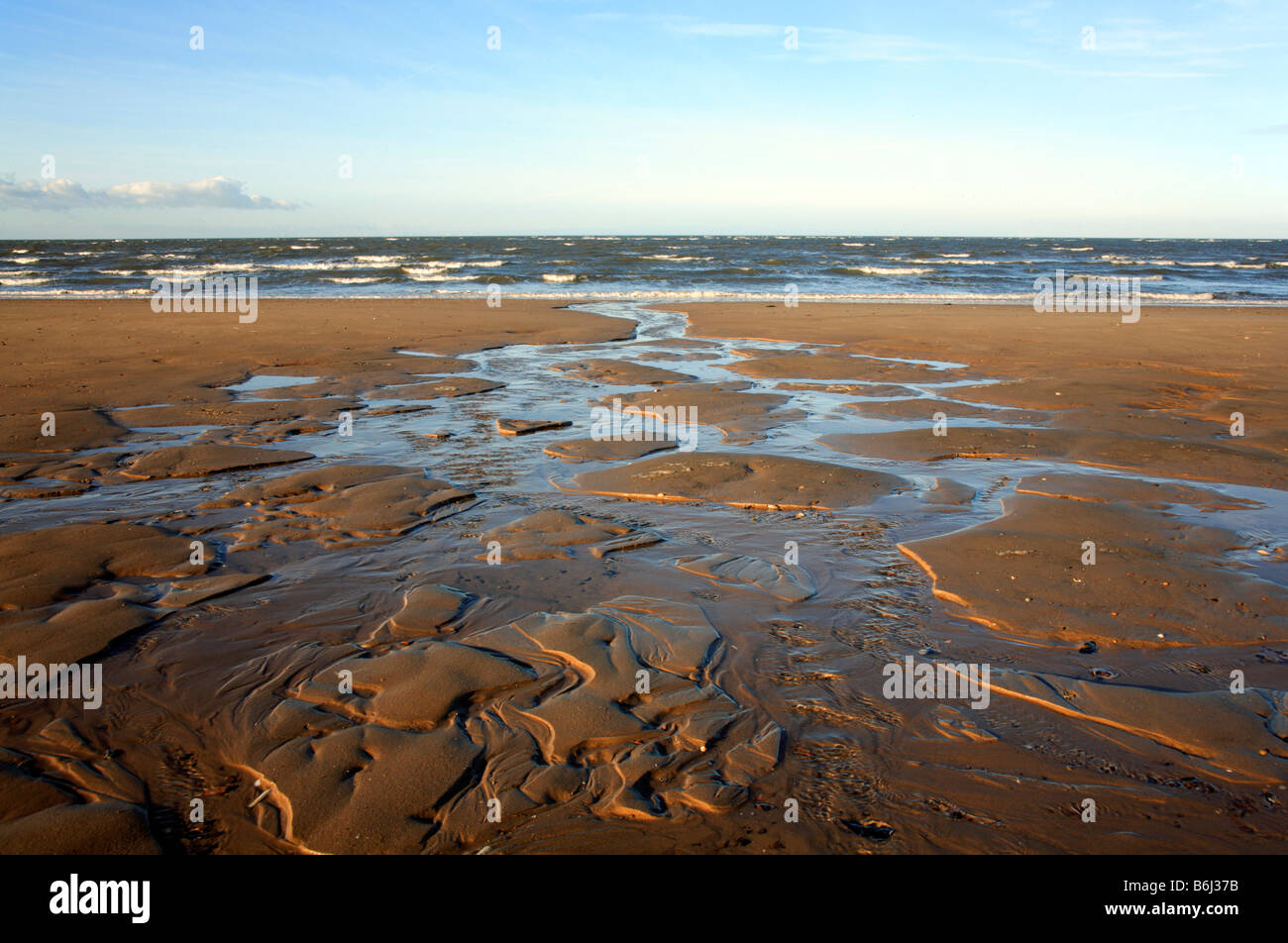 Patterns in the sand on the beach at Brancaster, Norfolk, UK Stock ...