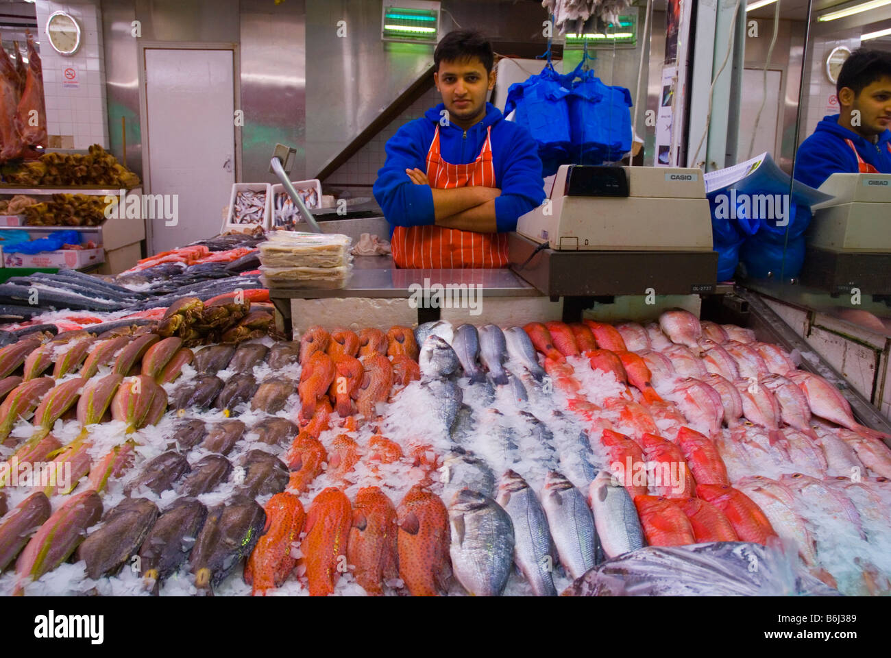 Fish seller in Brixton London England UK Stock Photo - Alamy