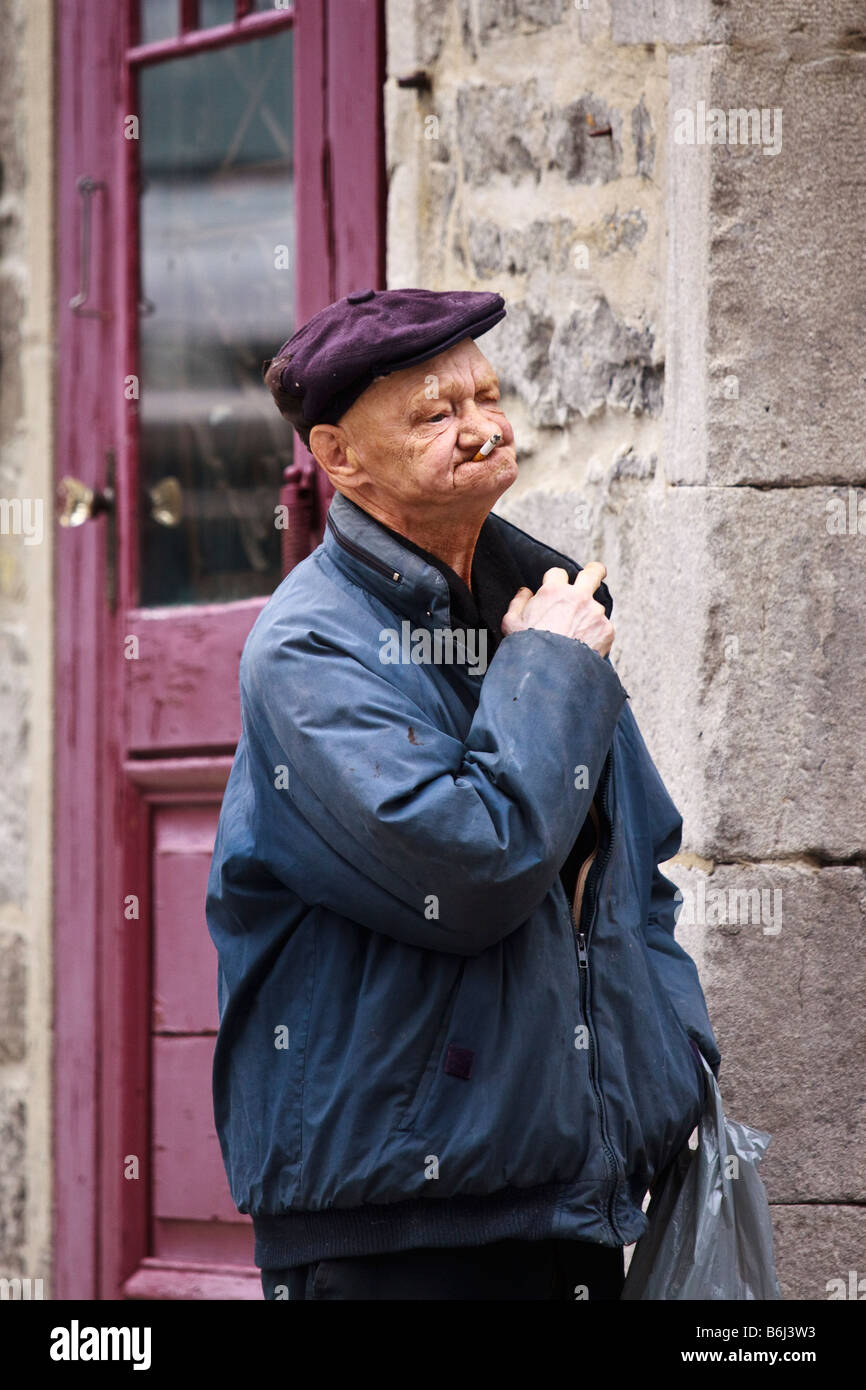 Old man with no teeth smoking cigarette Old Town Montreal Quebec Canada ...