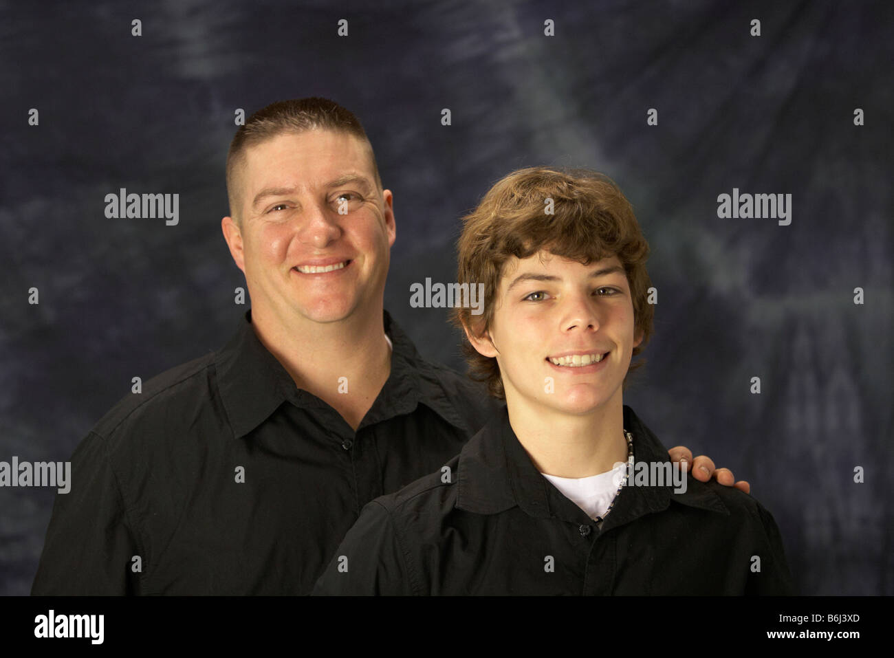 A father and son smiling Stock Photo - Alamy