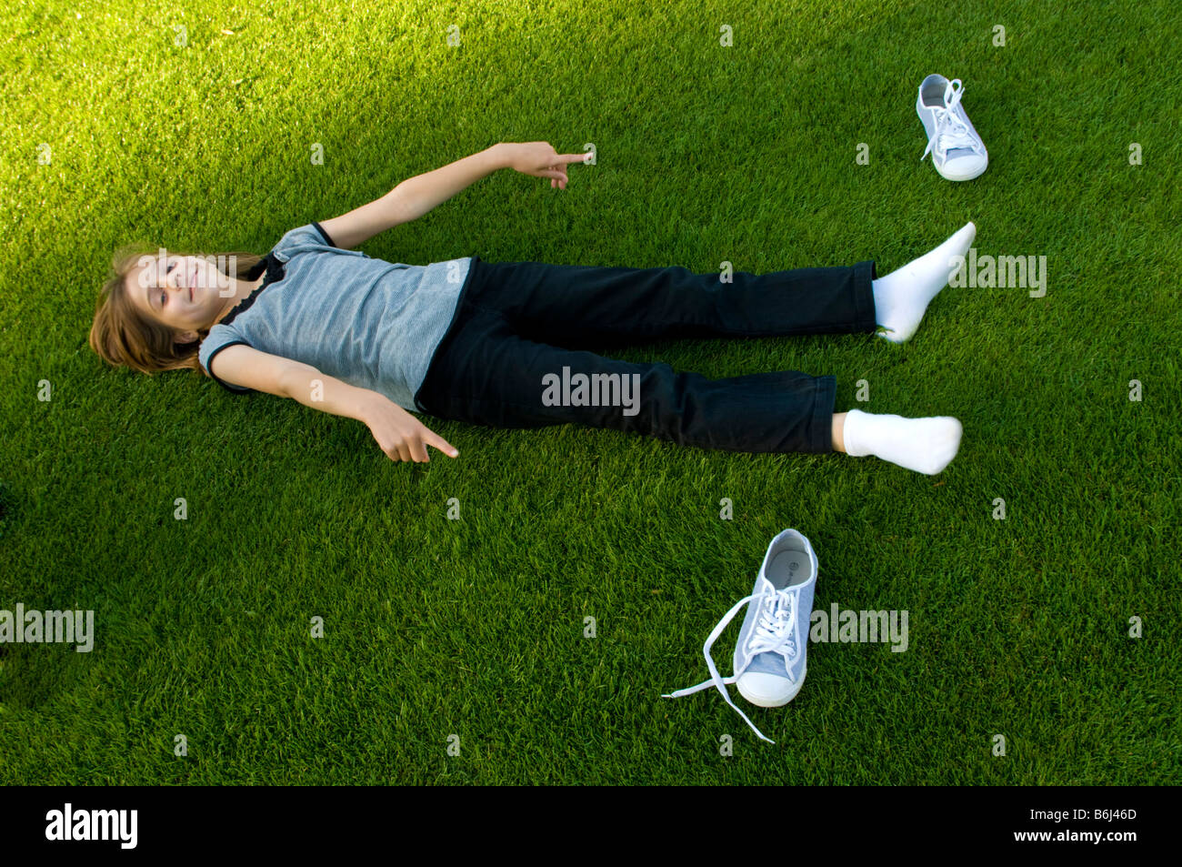 girl child pointing at shoes parkland Stock Photo - Alamy