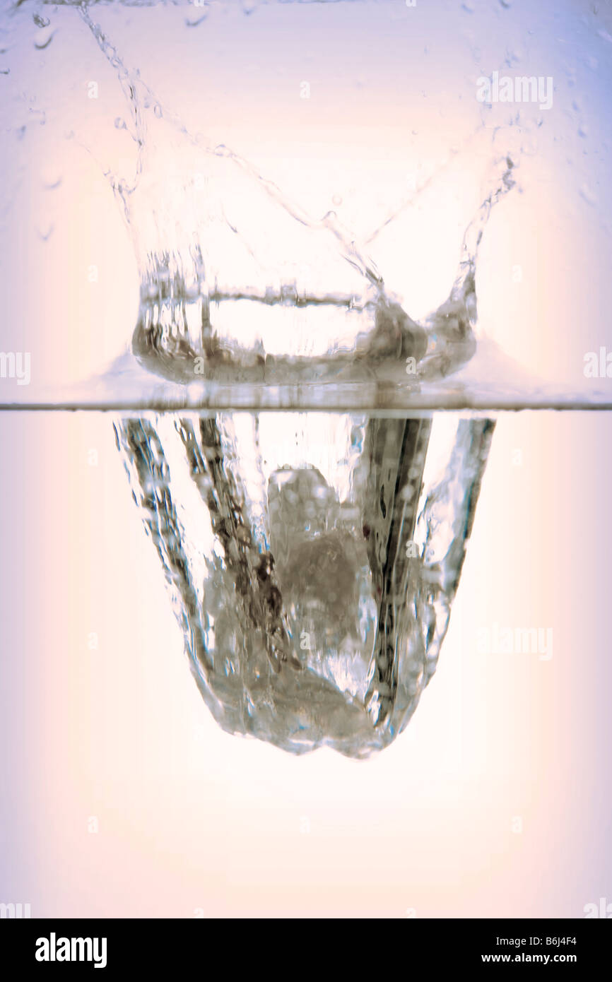 ICE CUBE SPLASHING INTO WATER Stock Photo - Alamy