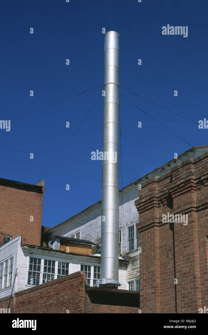 Smokestack at an abandoned factory Stock Photo - Alamy