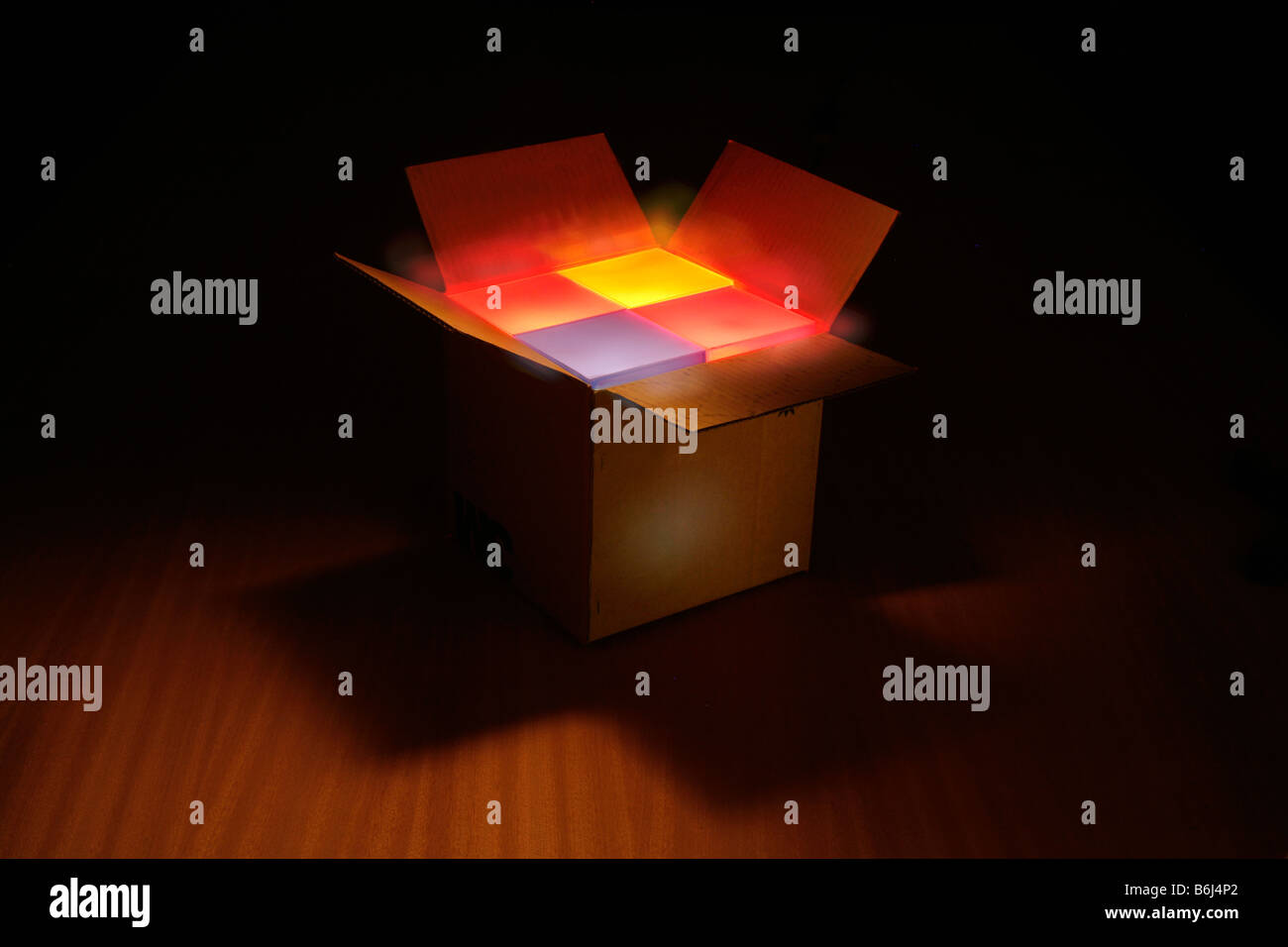 Cardboard box with light emitting cubes 2 Stock Photo - Alamy