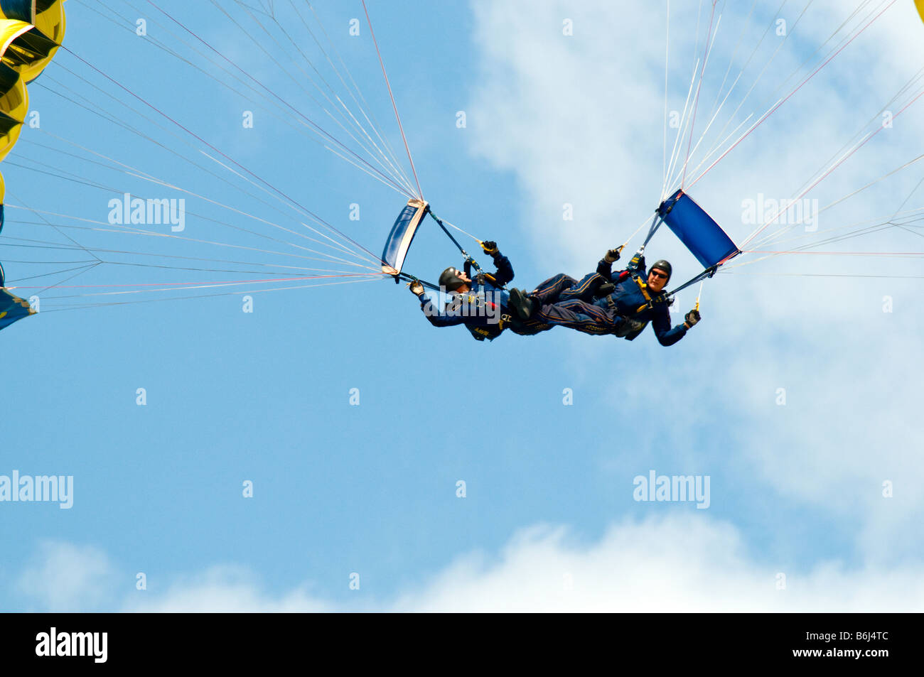 Two members of the elite US Navy Leap Frog Parachute Team performing a ...