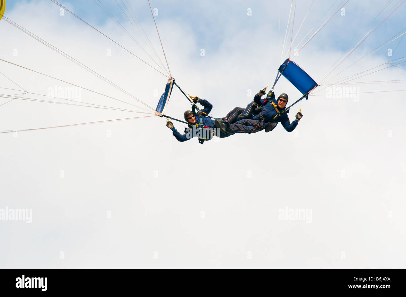 Two members of the elite US Navy Leap Frog Parachute Team performing a ...
