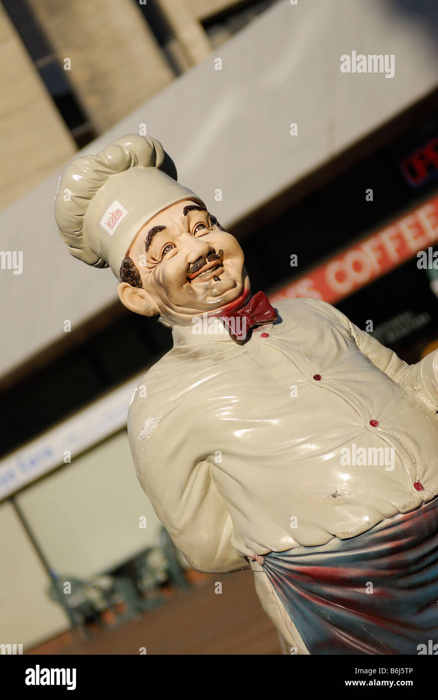 a friendly cook chief dress in traditional cooker costume Stock Photo ...