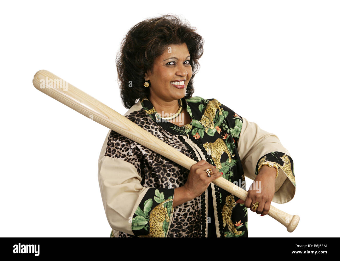 A beautiful ethnic woman smiling because she has a baseball bat to ...