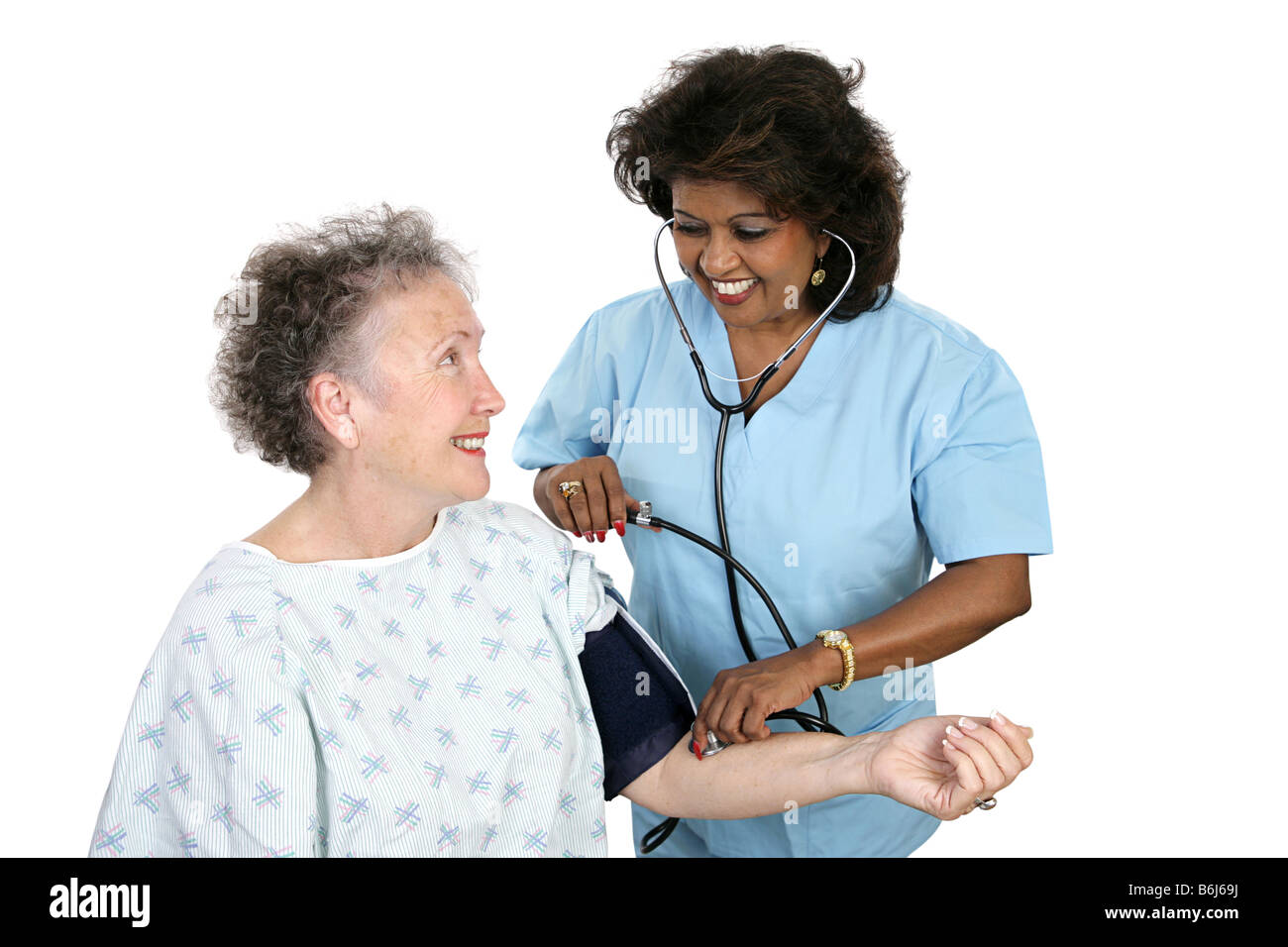 A pretty nurse taking a patient s blood pressure Isolated on white ...