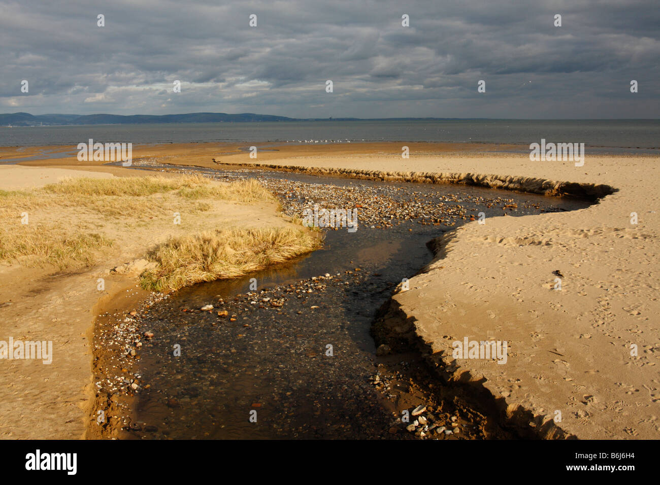 Stream flowing onto Blackpill Beach, Swansea Bay, West Glamorgan, South ...