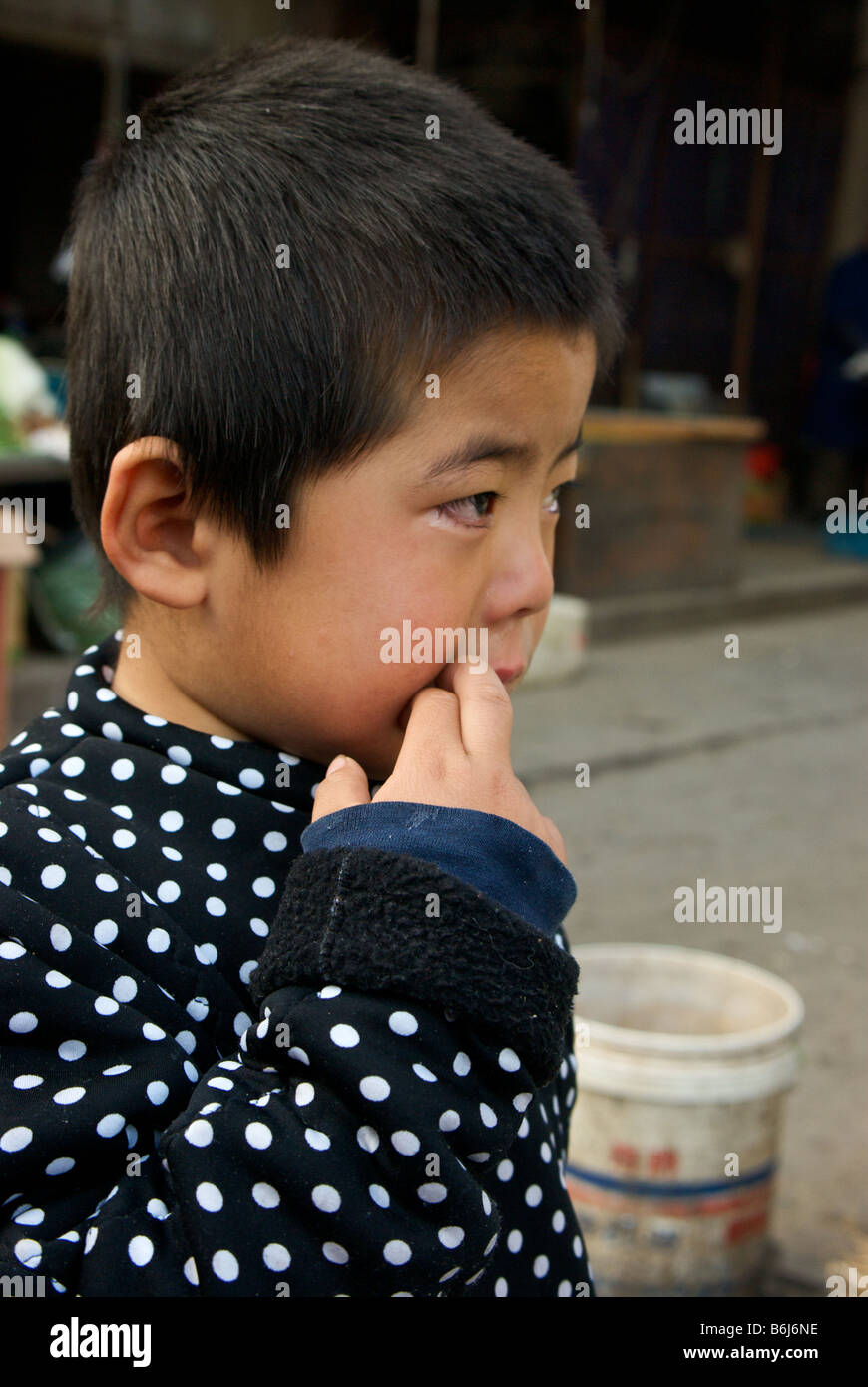Upset young Chinese boy crying Stock Photo - Alamy