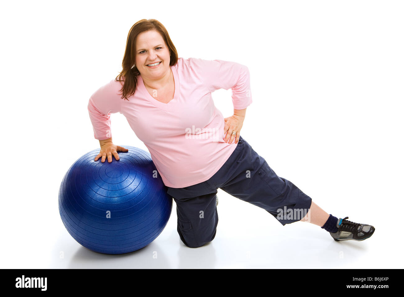 Beautiful plus sized model working out with a pilates fitness ball Full ...