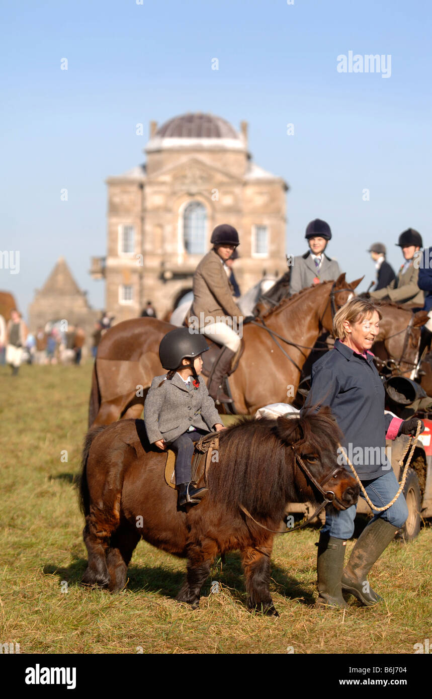 A YOUNG RIDER JOINS THE BEAUFORT HUNT AT A MEETING AT WORCESTER LODGE ...