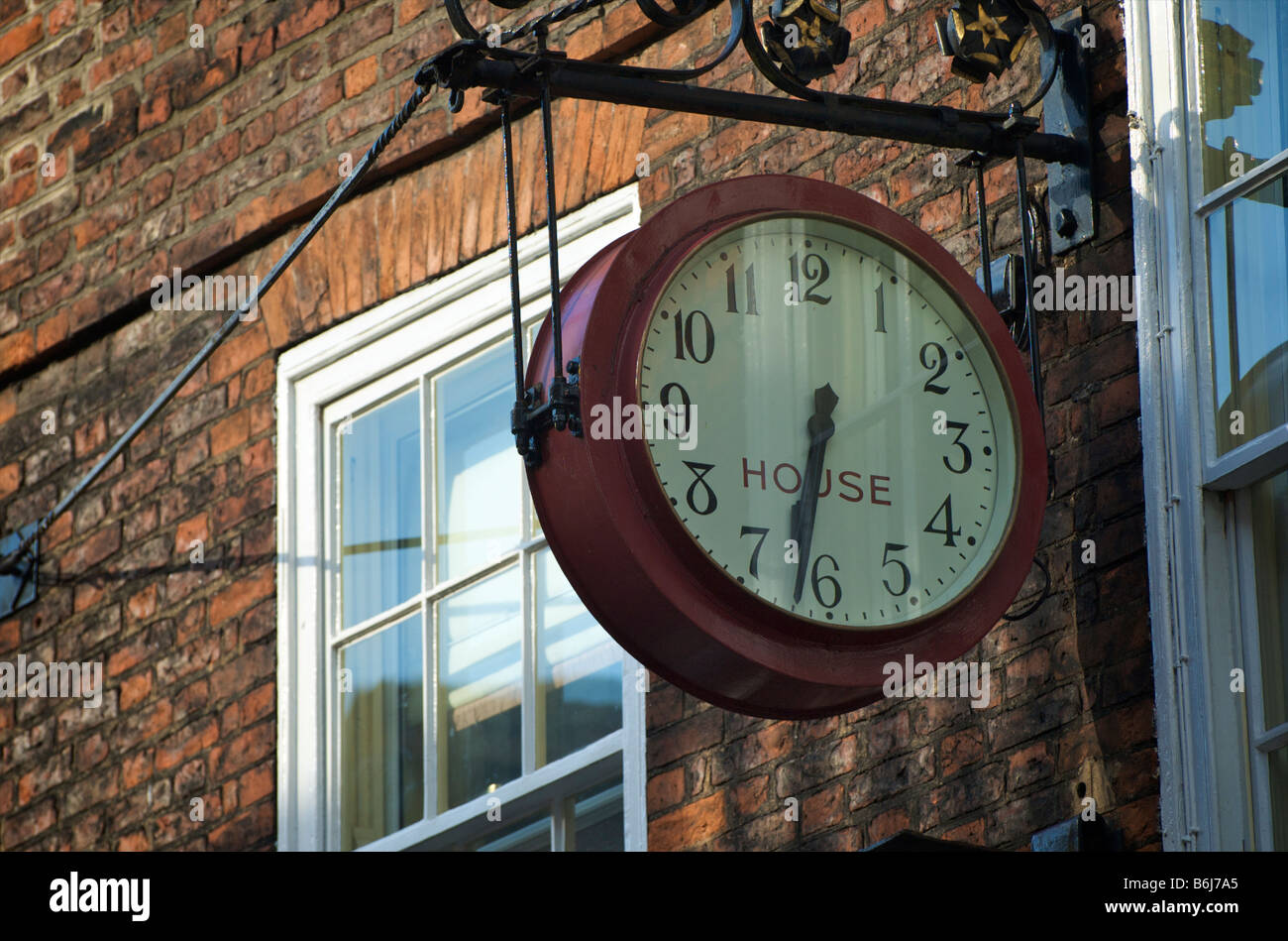 Hanging clock hi-res stock photography and images - Alamy