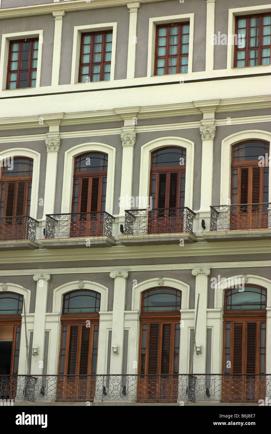 Cuban building architecture with arched shuttered windows and balconies ...
