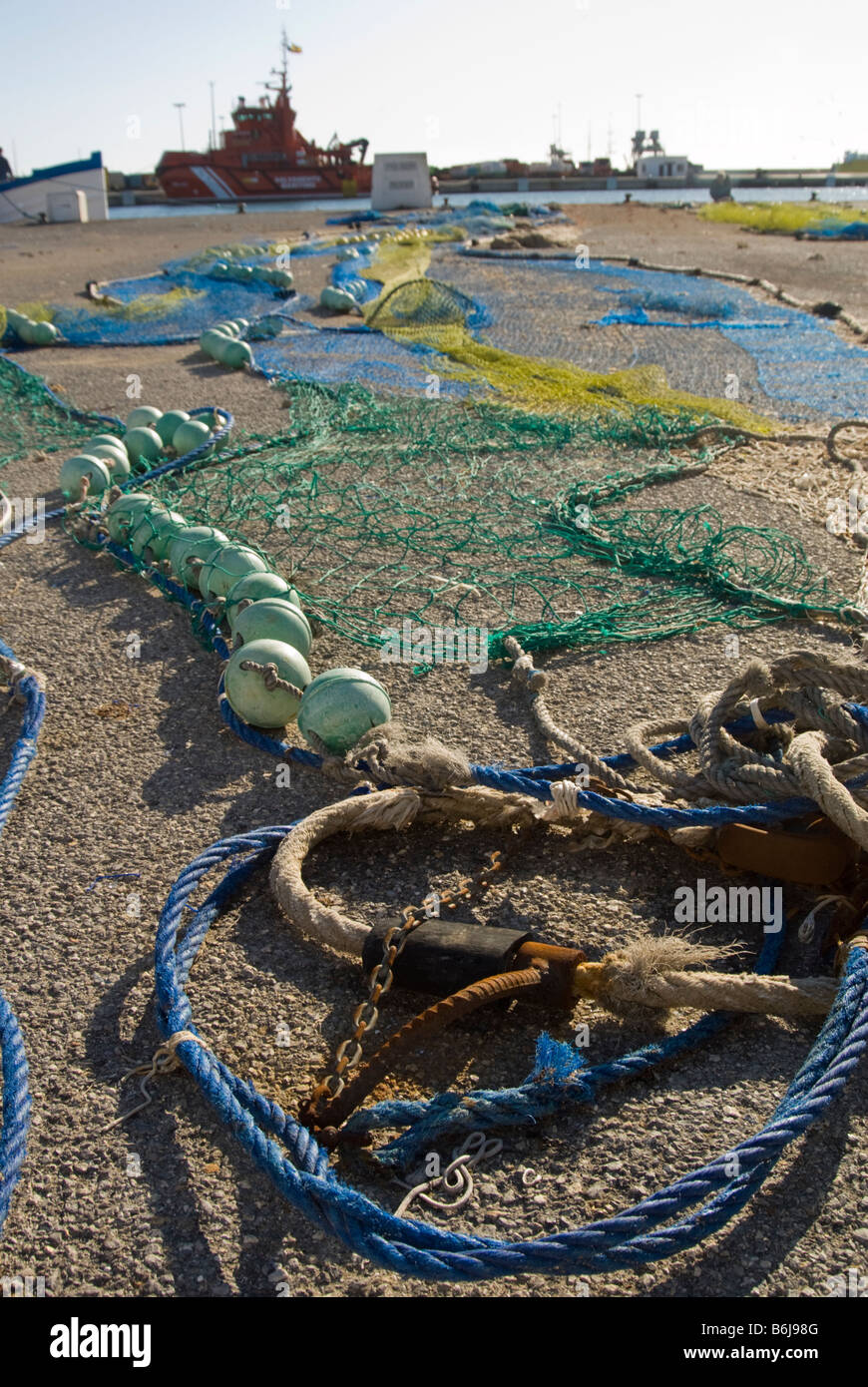 Throwel net on dock waiting to be repaired Stock Photo - Alamy