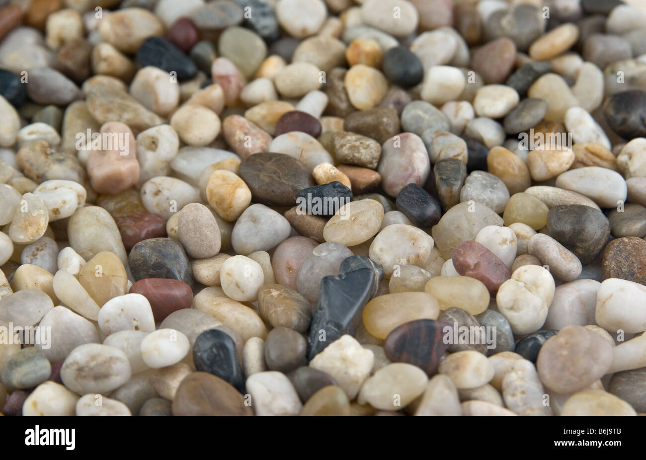 great image of a small stones pebble background Stock Photo - Alamy