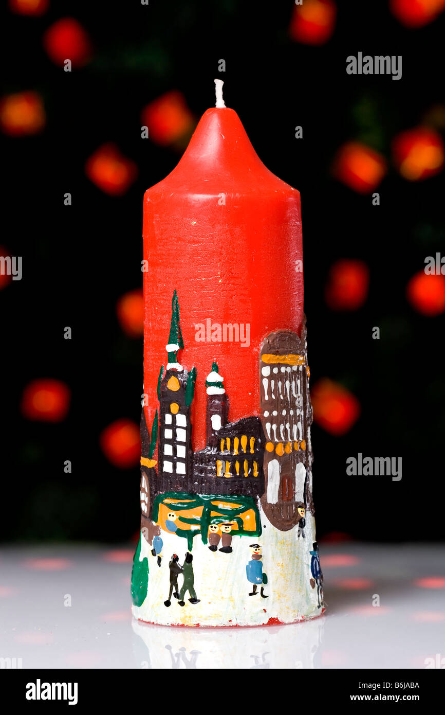 christmas candle with defocused red light bulbs in the background Stock ...
