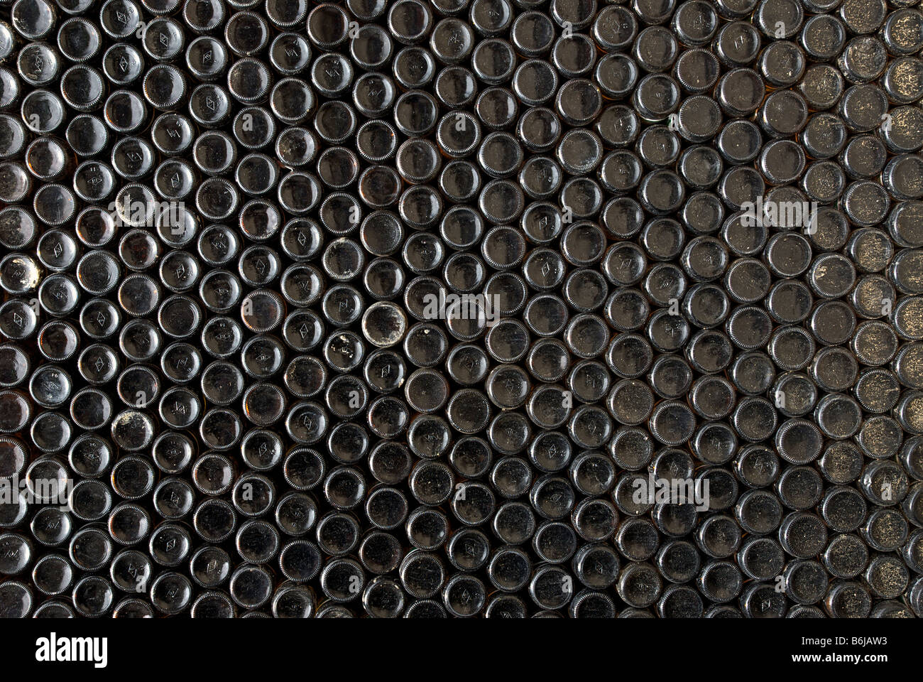 Stack of glass bottles viewed from their bases Stock Photo - Alamy