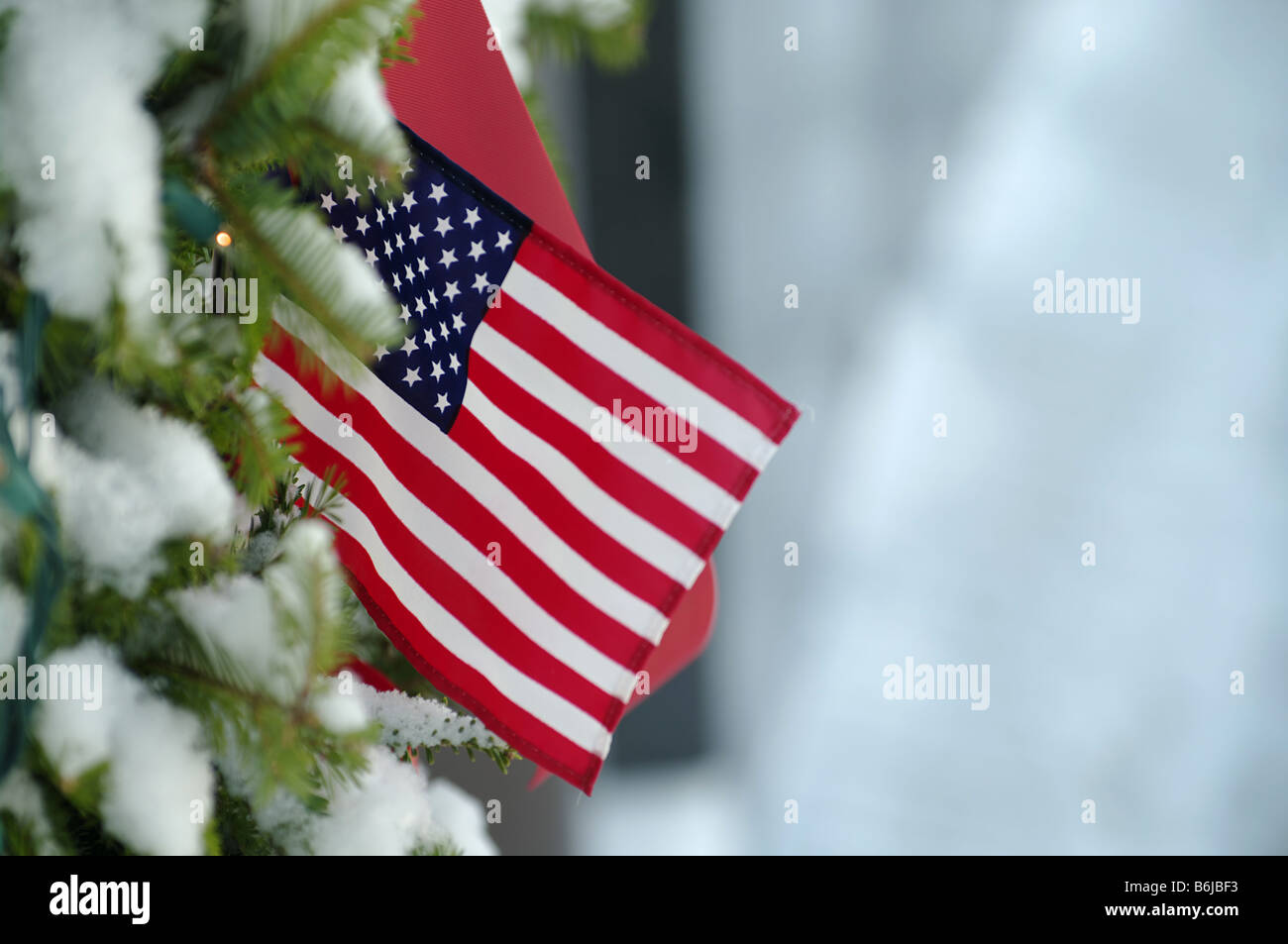 American flag in winter with snow hi-res stock photography and images ...
