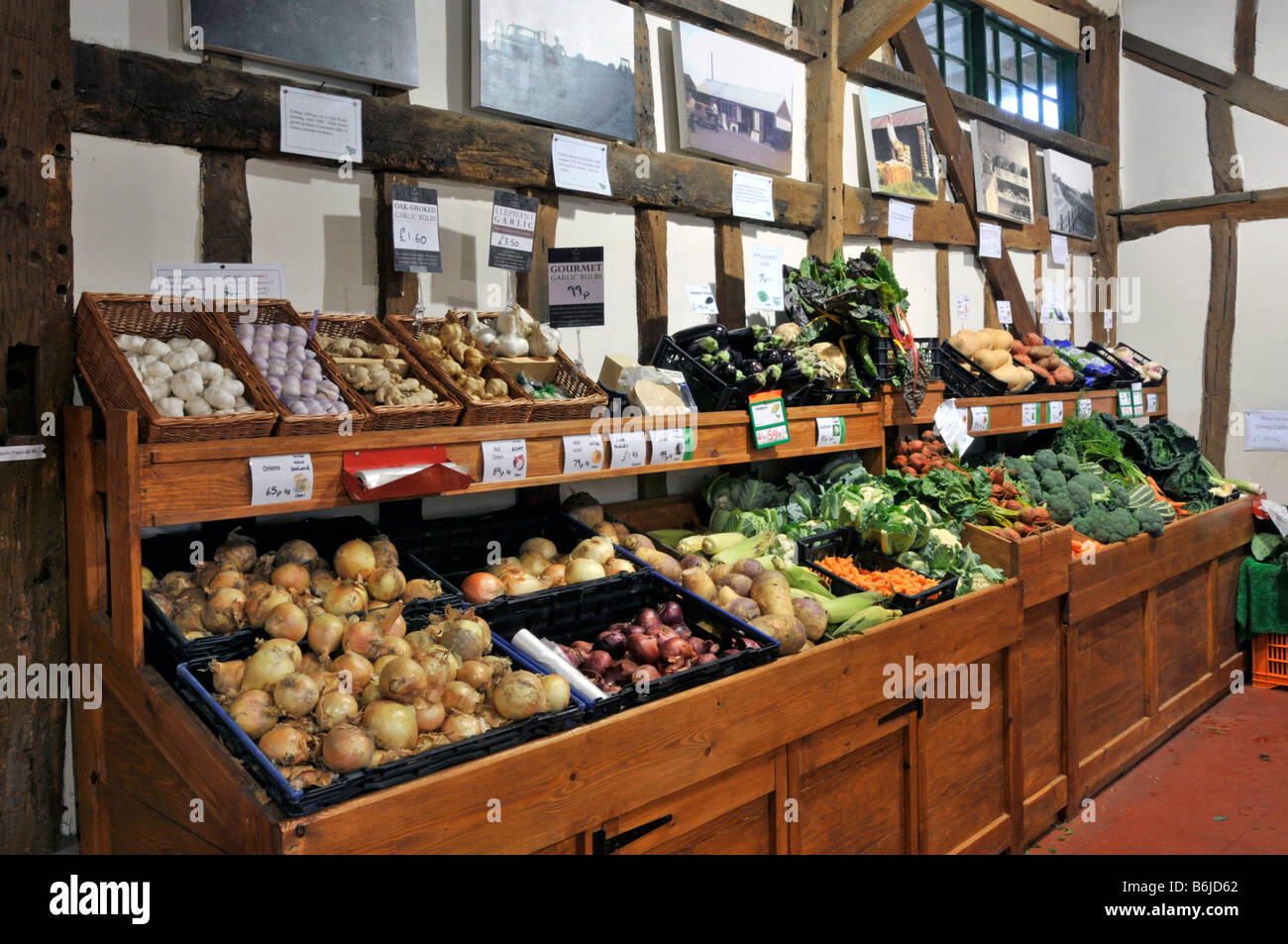 Interior Farm Shop display of assorted vegetables including garlic and ...
