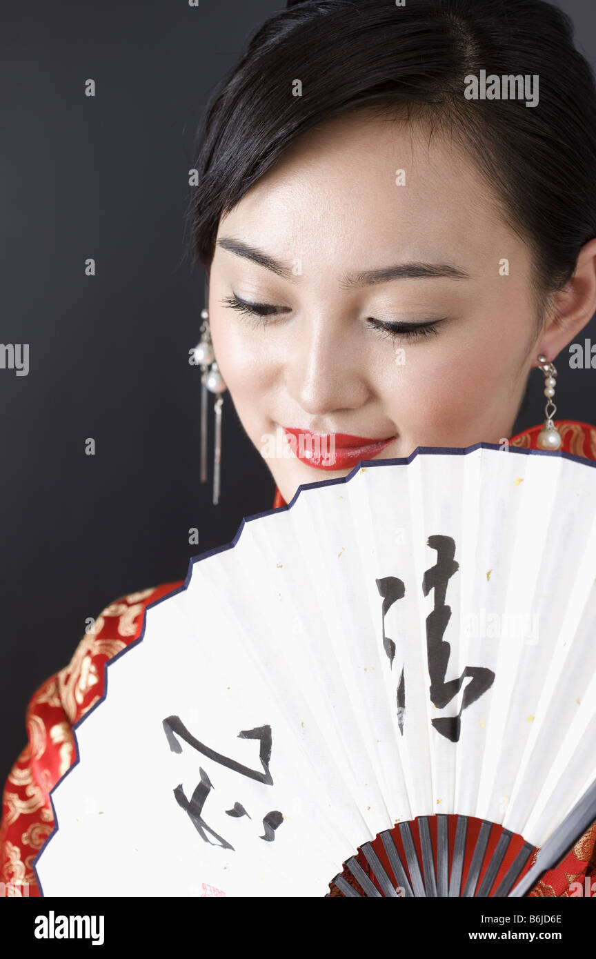 Close up young woman folding fan hi-res stock photography and images - Alamy