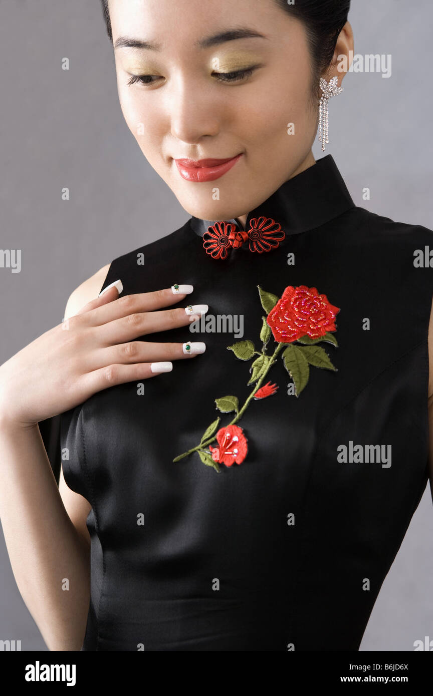 Young woman with black cheongsam Stock Photo - Alamy