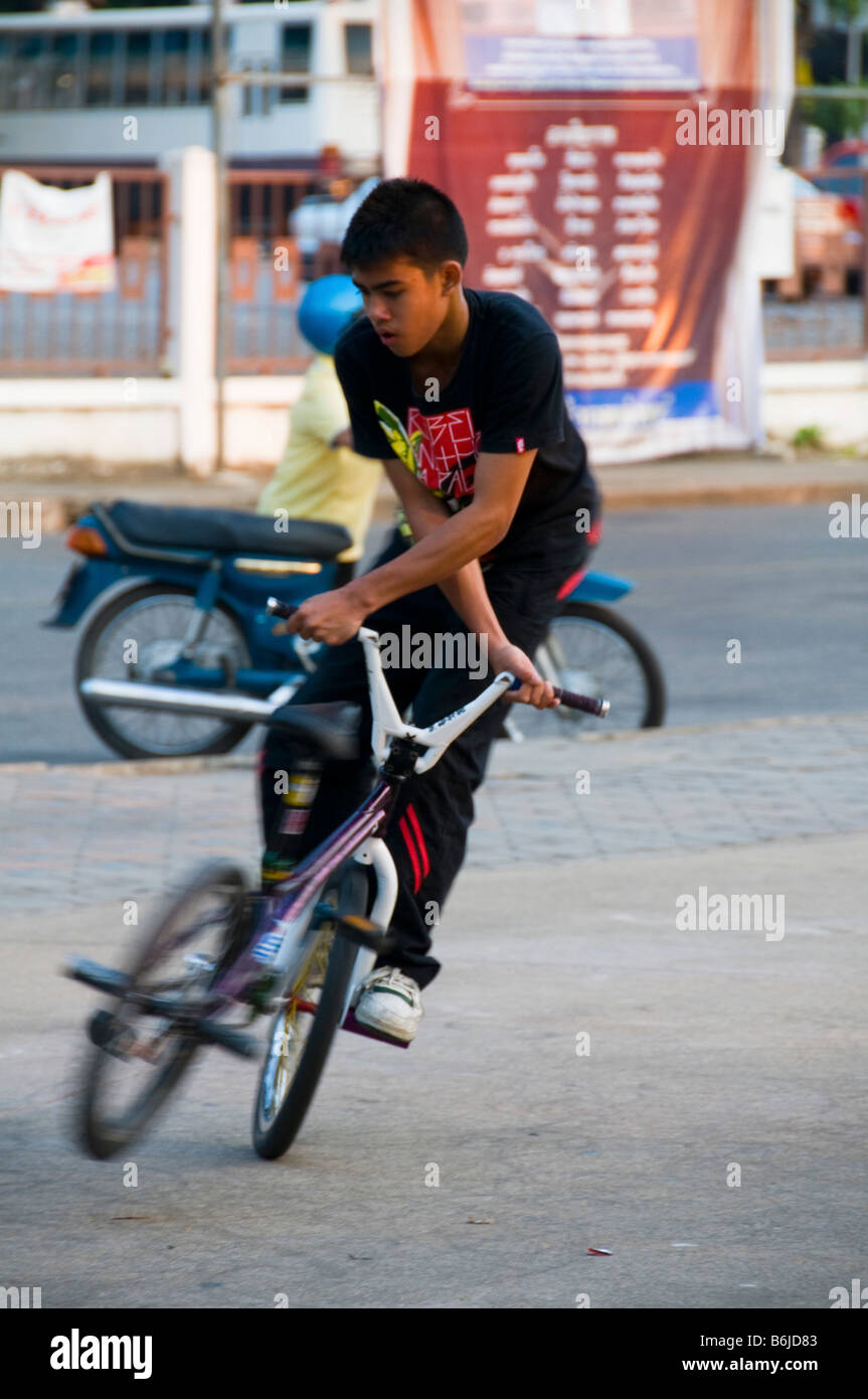 boy doing bicycle stunts in Bangkok Thailand Stock Photo - Alamy