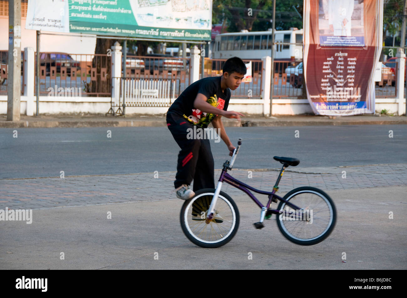 boy doing bicycle stunts in Bangkok Thailand Stock Photo - Alamy