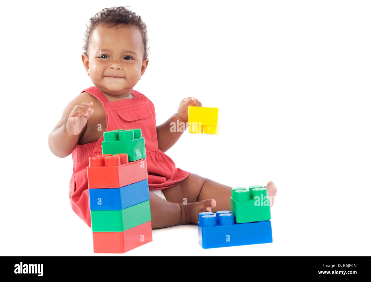 Baby girl playing with building blocks over white background Stock ...