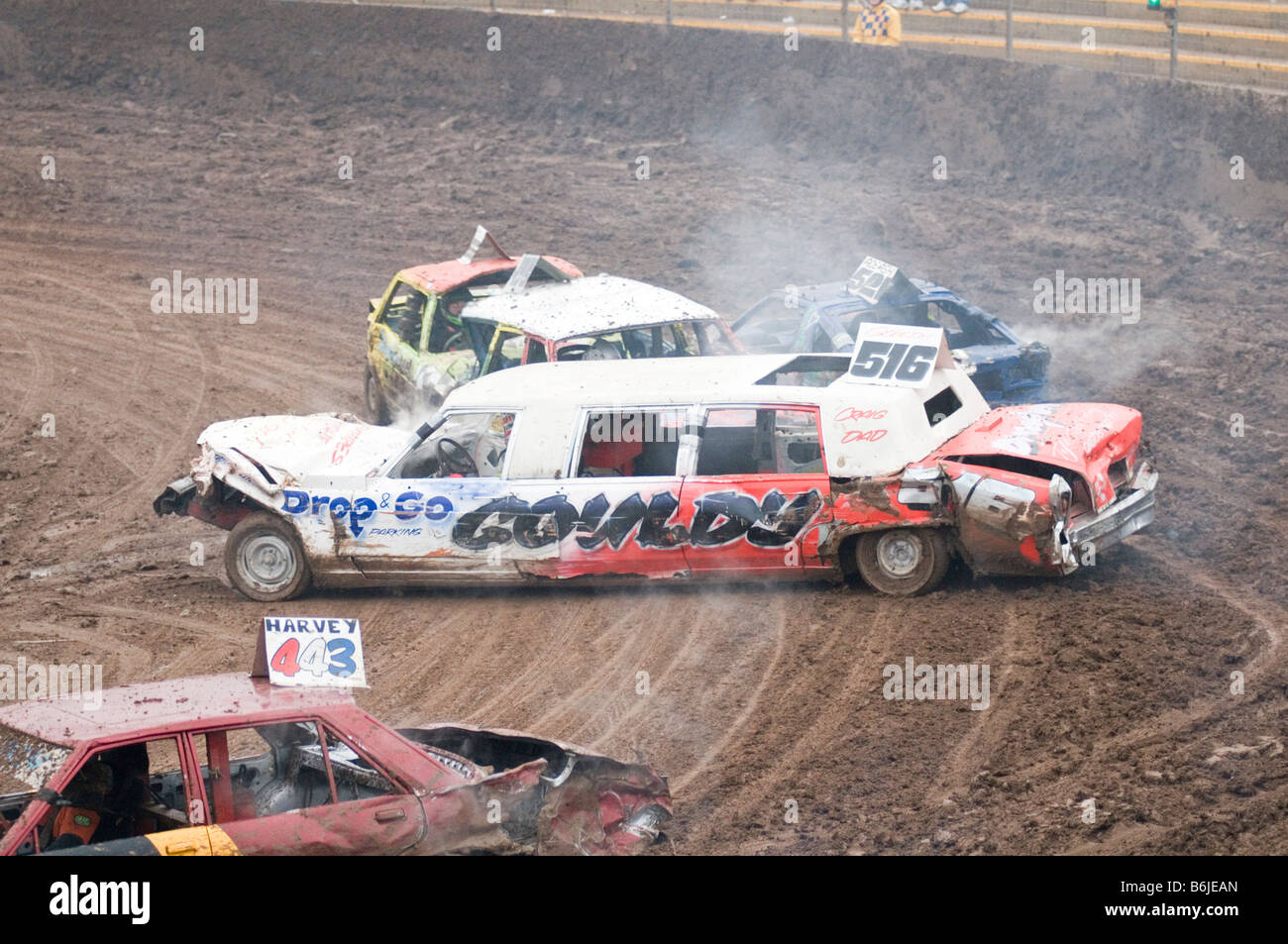 old limousine getting smashed up in a demolition derby Stock Photo - Alamy